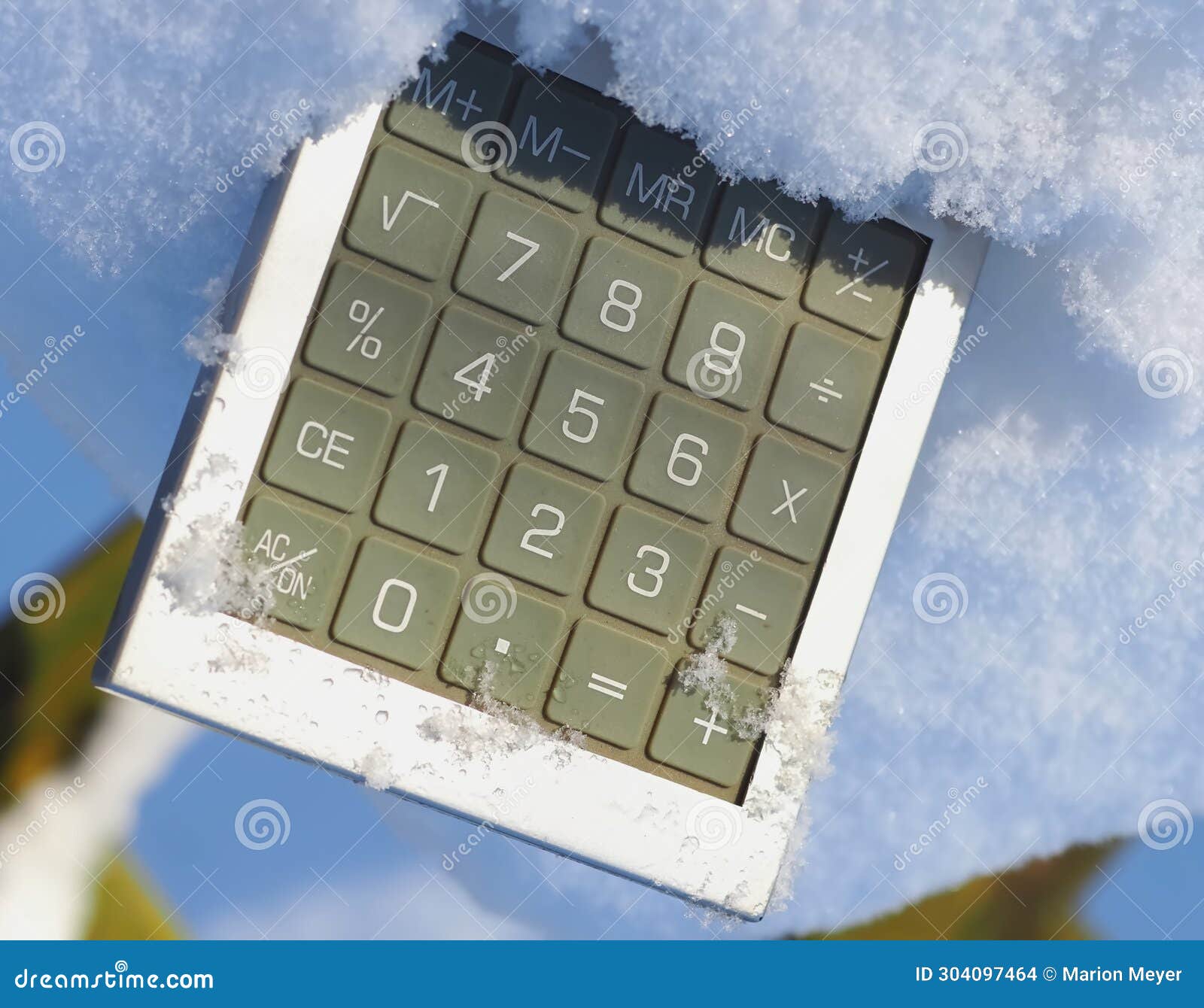 Silver Calculator with Keys in the Snow Stock Photo - Image of ...