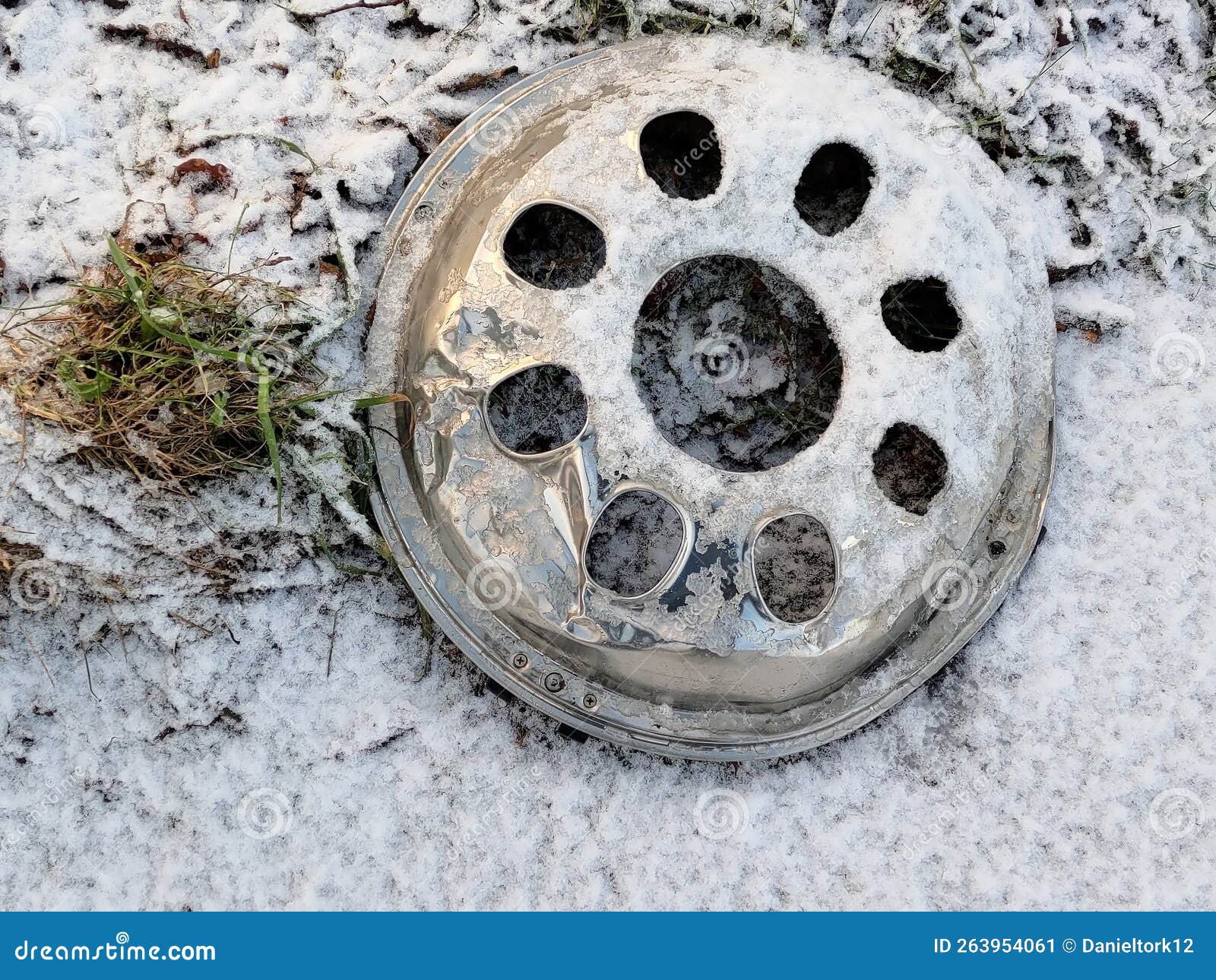 Silver Car Hubcap Lying in Snow Stock Image - Image of torn, wheel ...