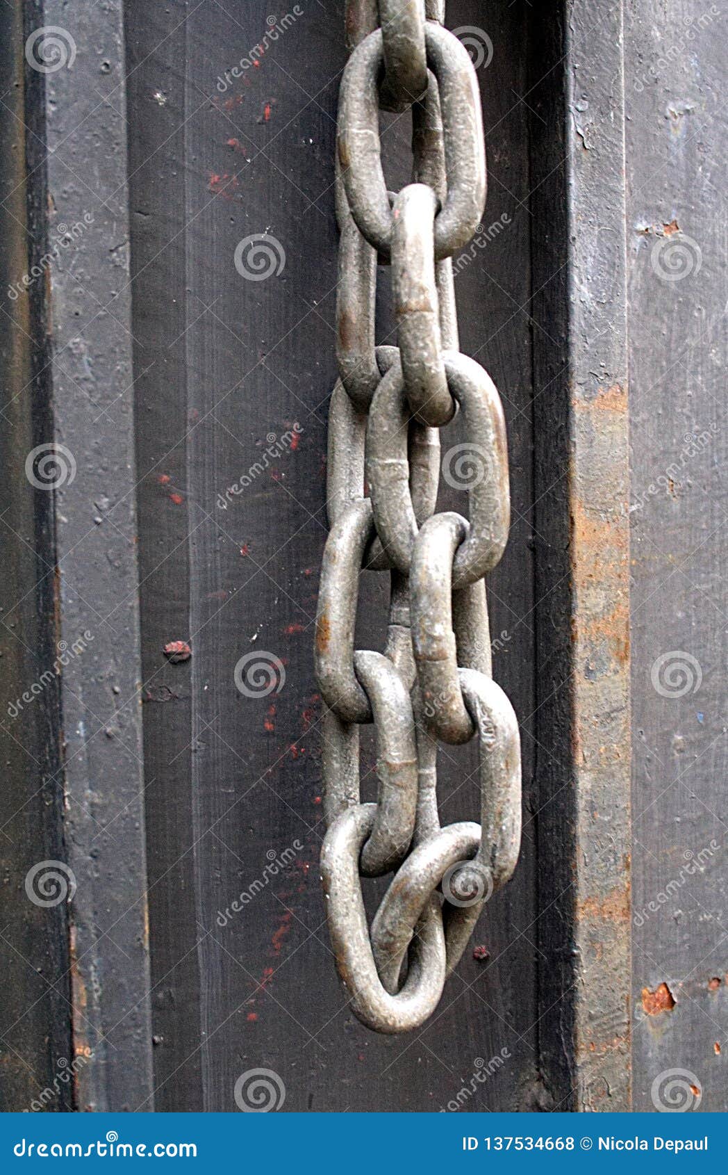 Silver Chain Against Dark Metal Wall Stock Photo - Image of wall, chain ...