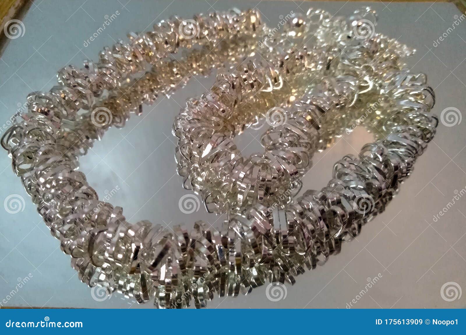 Silver Chain Mail Link Necklace Jewelry on Mirror Surface Stock Image ...
