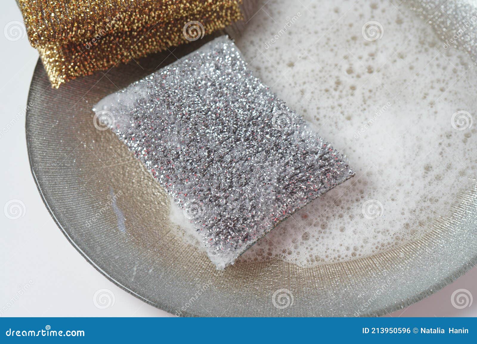 Silver Cleaning Sponge in Soap Foam on a Plate Stock Photo - Image of ...