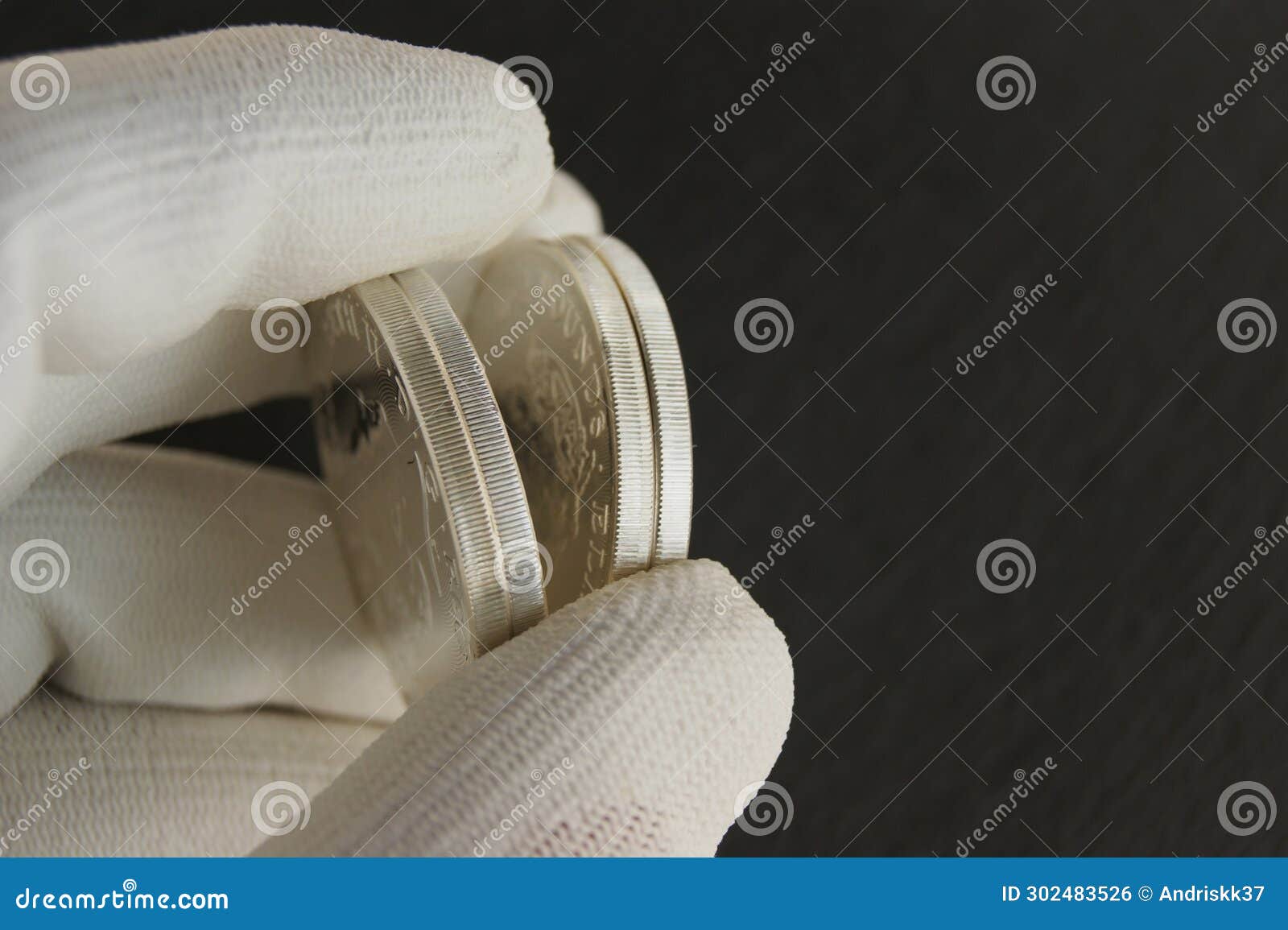 Silver Coins in the Hand of a Numismatist. Grooved Coin Edges Stock ...