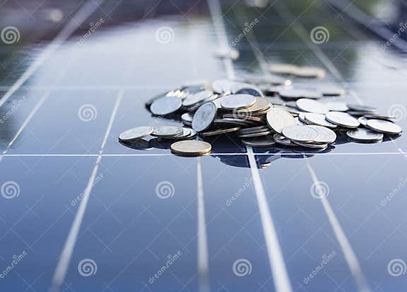 Silver Coins on the Solar Panel Help Store Solar Energy Stock Image ...