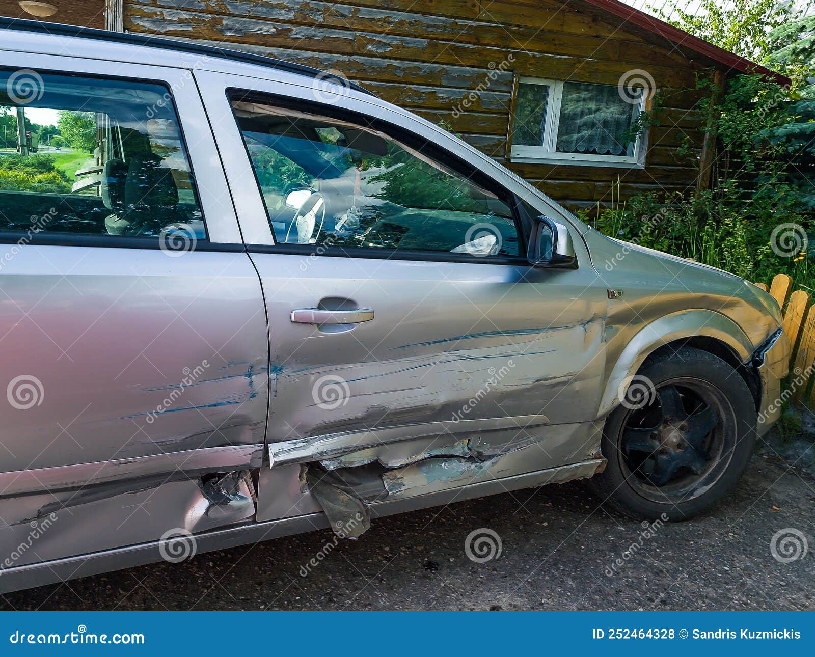 Silver Colored Car with Scratches and Extensive Damage To the Doors ...