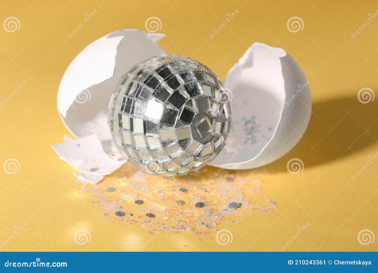 Silver Disco Ball, Broken Eggshell and Glitter Sprinkles on Yellow ...