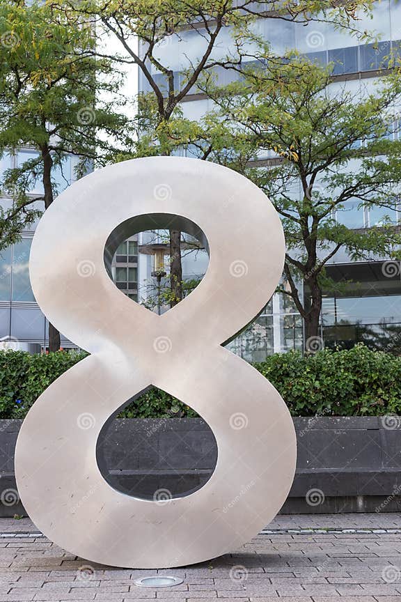 Silver Eight in Front of Modern Office Buildings Stock Photo - Image of ...