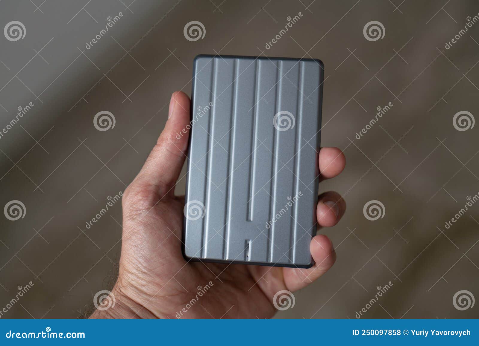 Silver External Hard Drive in Mans Hand. External HD Stock Photo ...