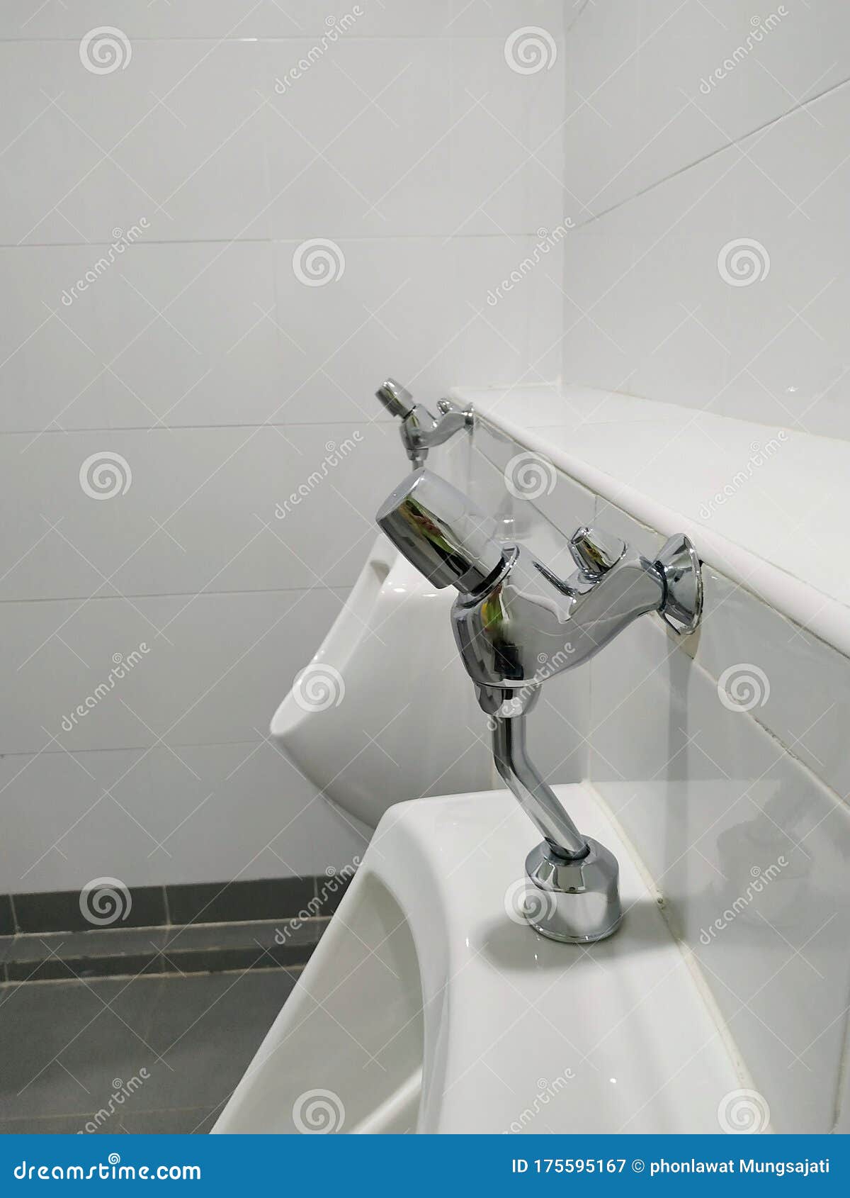 Silver Faucets of White Urinal in the Toilet Room. Stock Image - Image ...