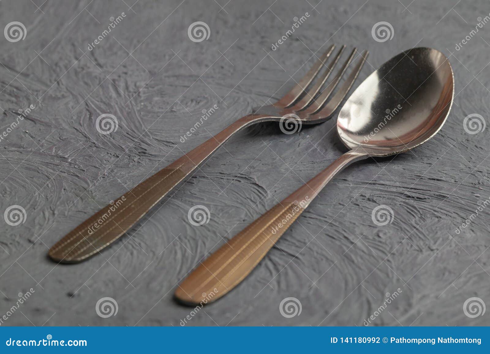 Silver fork and spoon stock photo. Image of food, decorative - 141180992