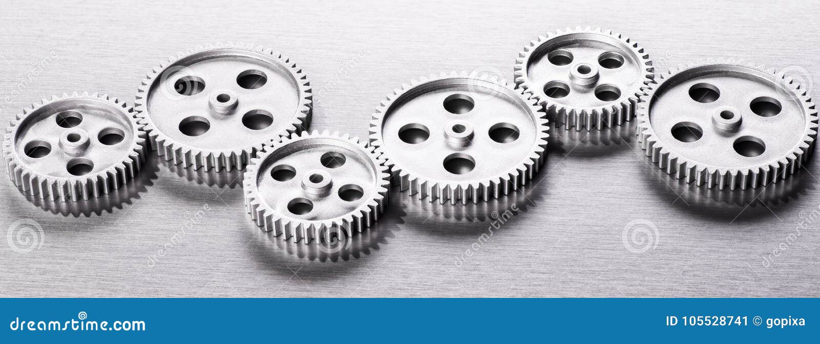 Silver gears in a row stock image. Image of mechanics - 105528741