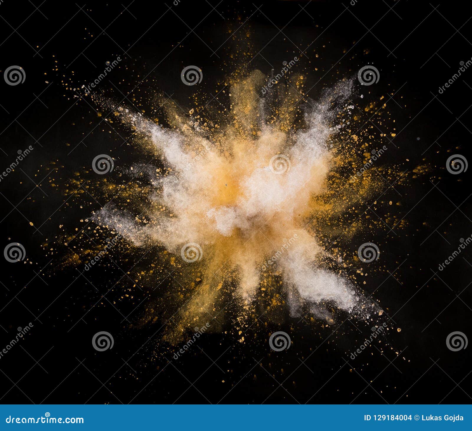 Silver and Gold Powder Explosion on Black Background. Stock Photo ...
