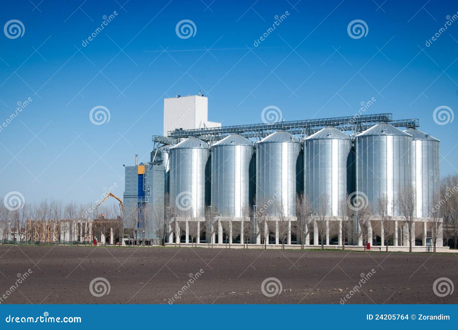 Silver Grain Silos with Blue Sky in Background Stock Photo - Image of ...