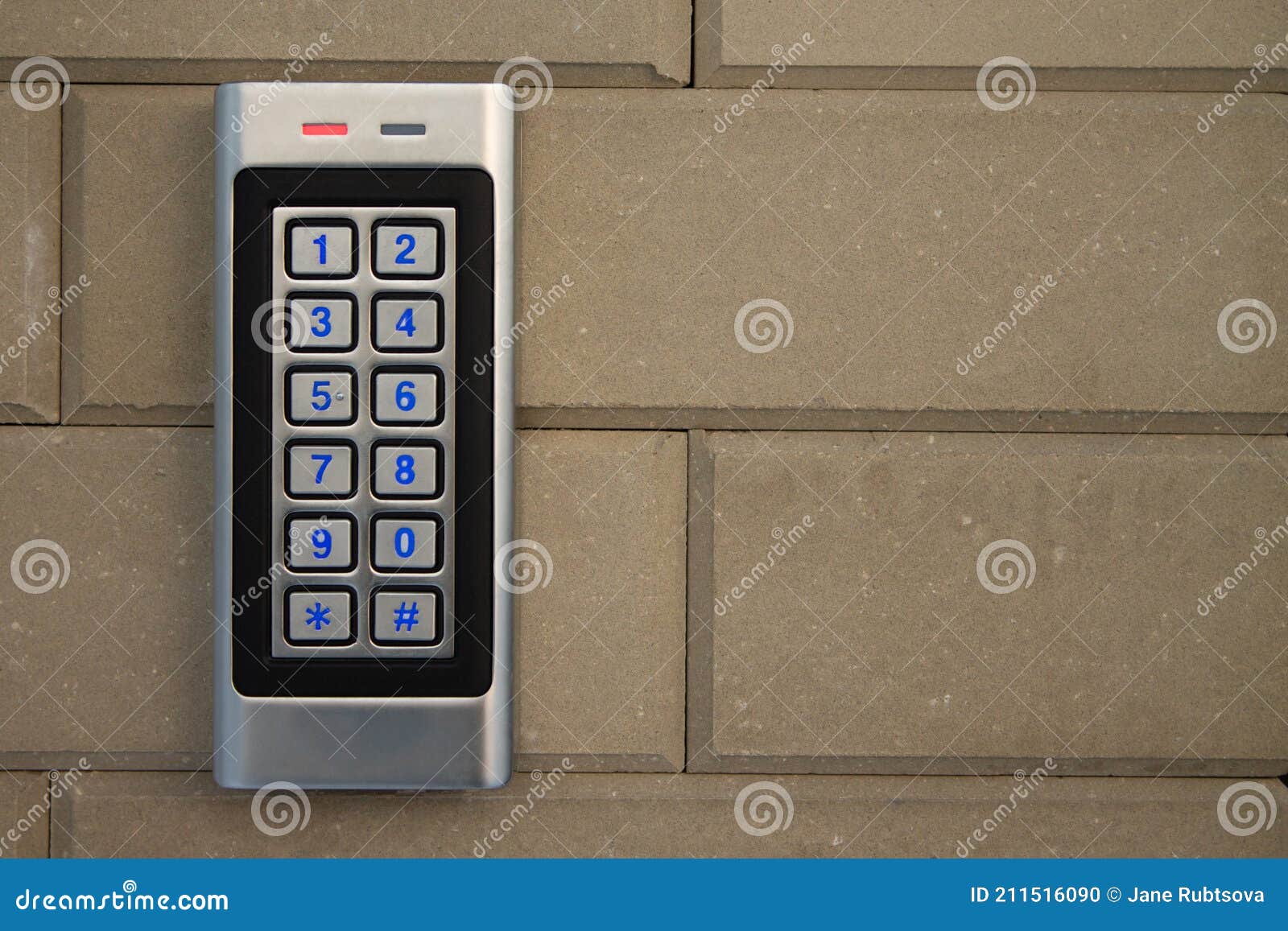 Silver Intercom Call Panel with Blue Number Buttons on a Brick Beige ...
