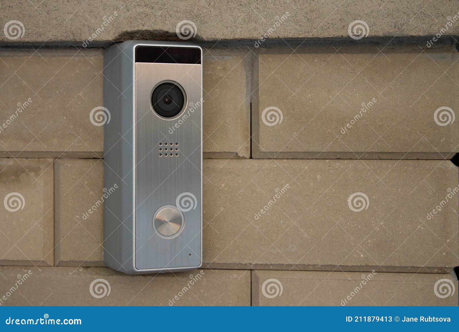 Silver Intercom Panel with Video Camera on a Brick Beige Fence Pillar ...