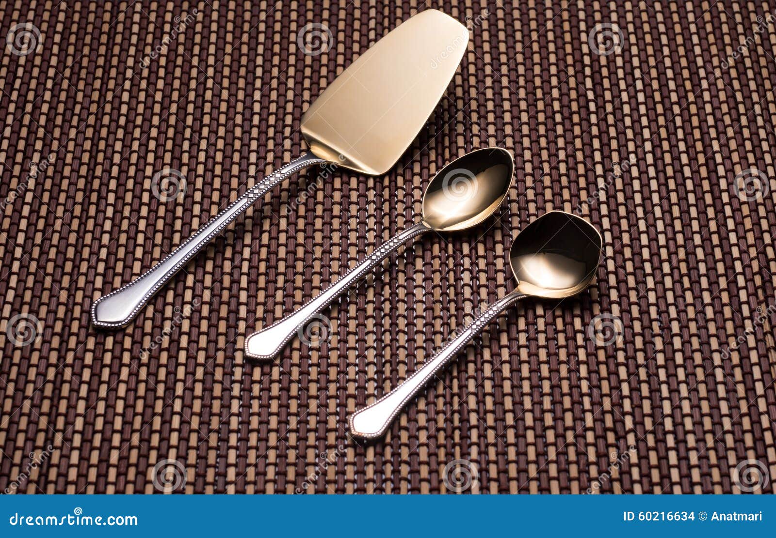 Silver Kitchen Utensils with Golden Spraying at the End. Stock Photo ...