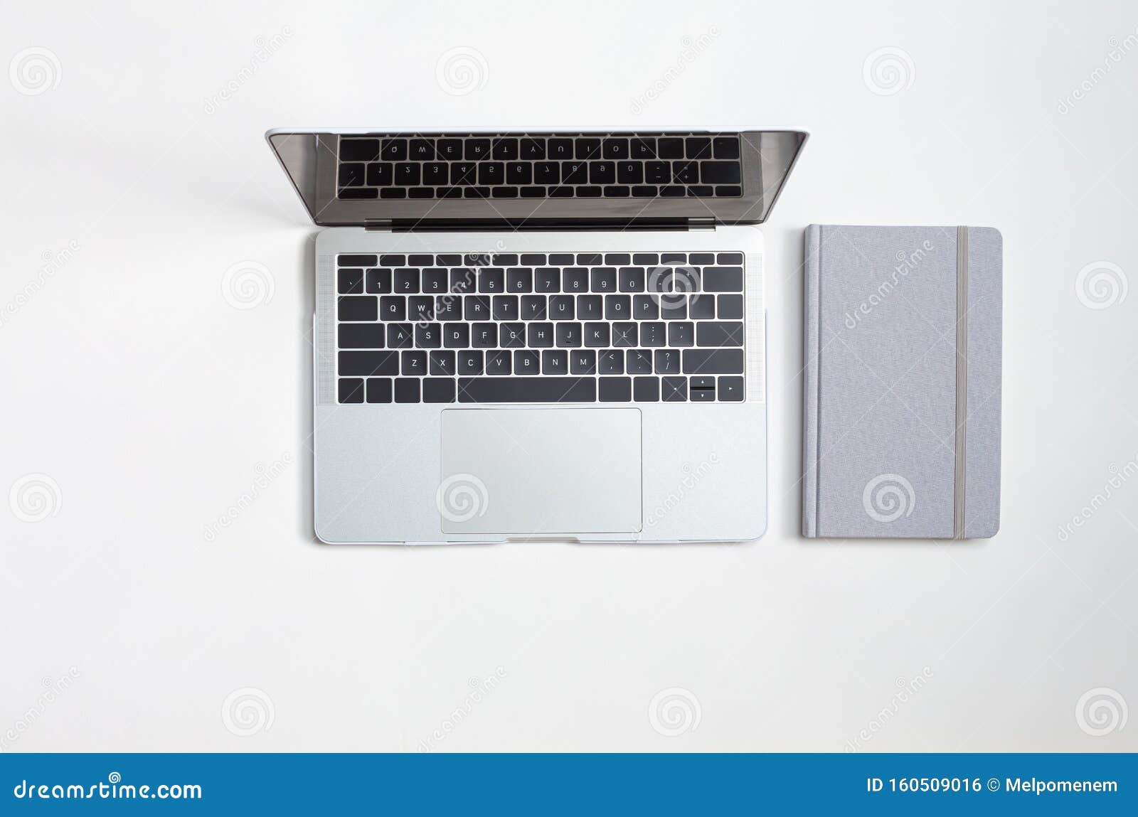 Silver Modern Laptop Computer with a Notebook Stock Photo - Image of ...