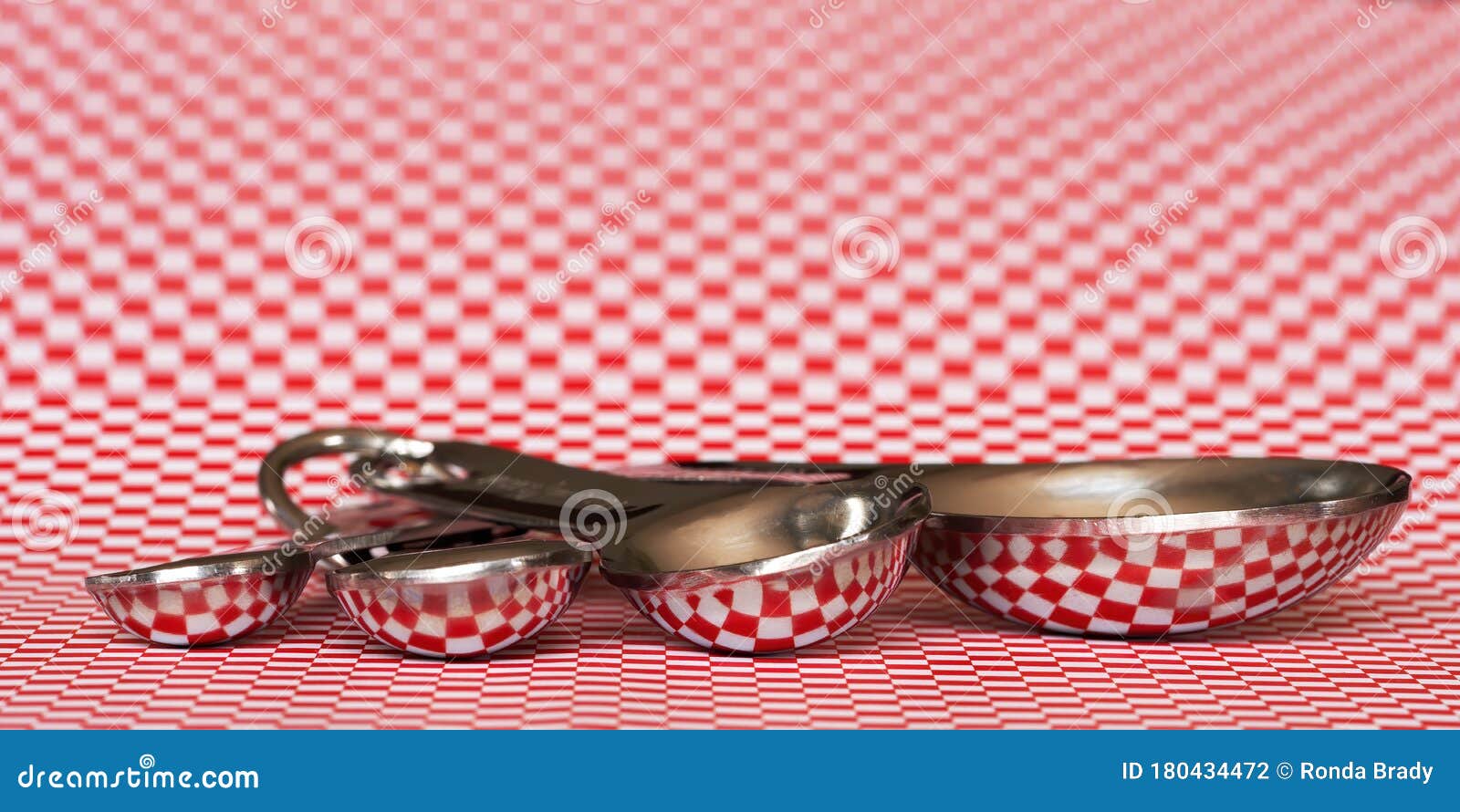 Measuring Spoons on Red and White Checkered Material Stock Photo ...