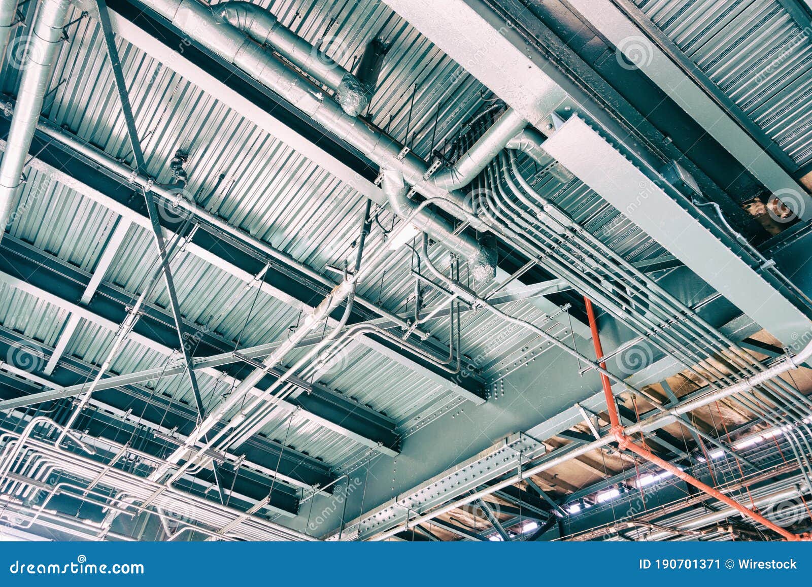 Silver Metallic Ceiling with Lots of Pipes at a Construction Site Stock ...