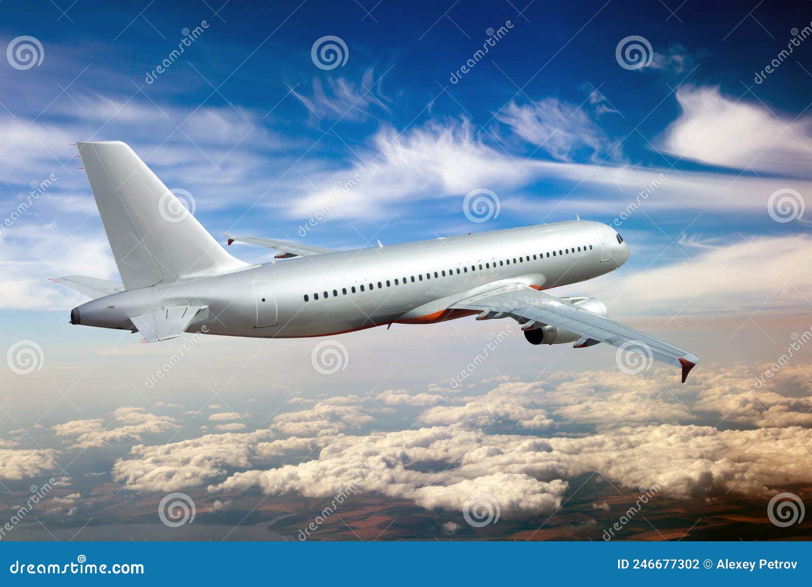 Silver Passenger Plane Iflies High Above the Clouds. Back View of ...