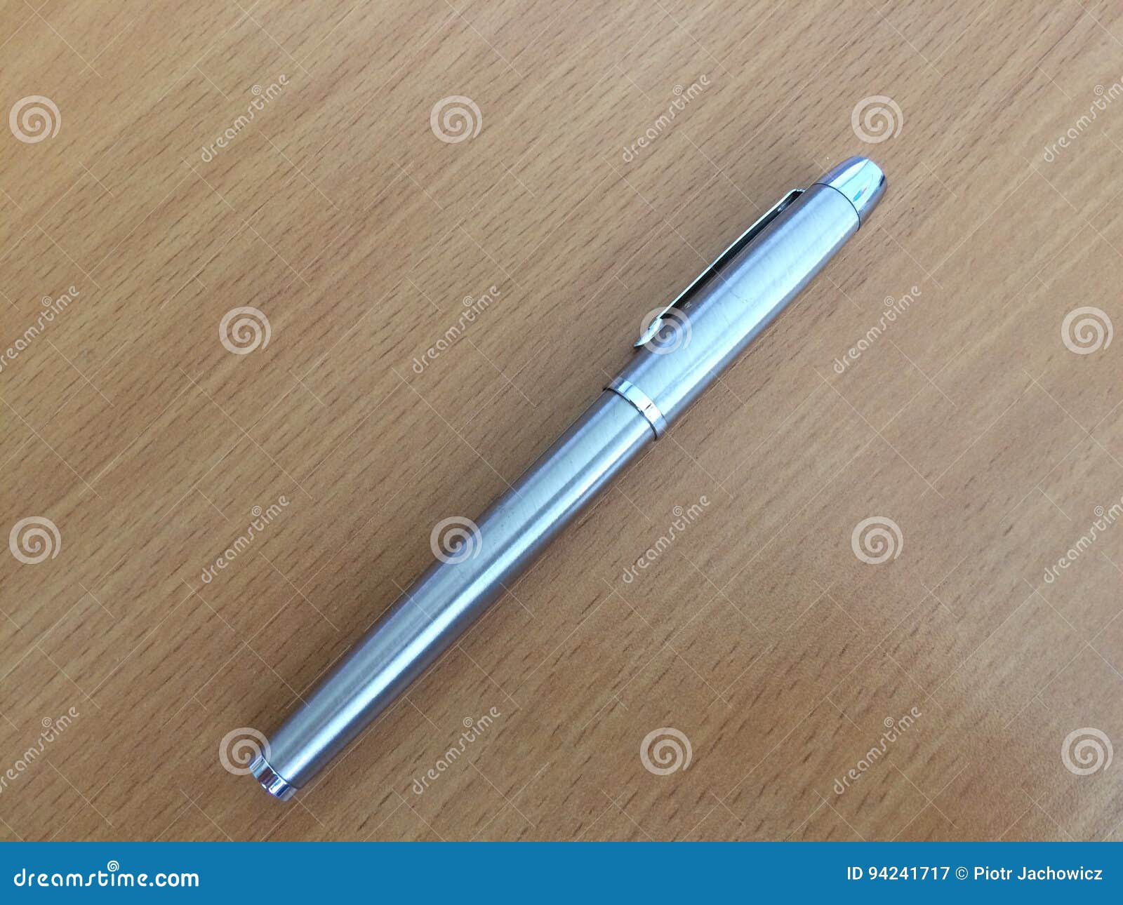 Silver Metal Pen on Brown Desk Stock Image - Image of metal, desk: 94241717
