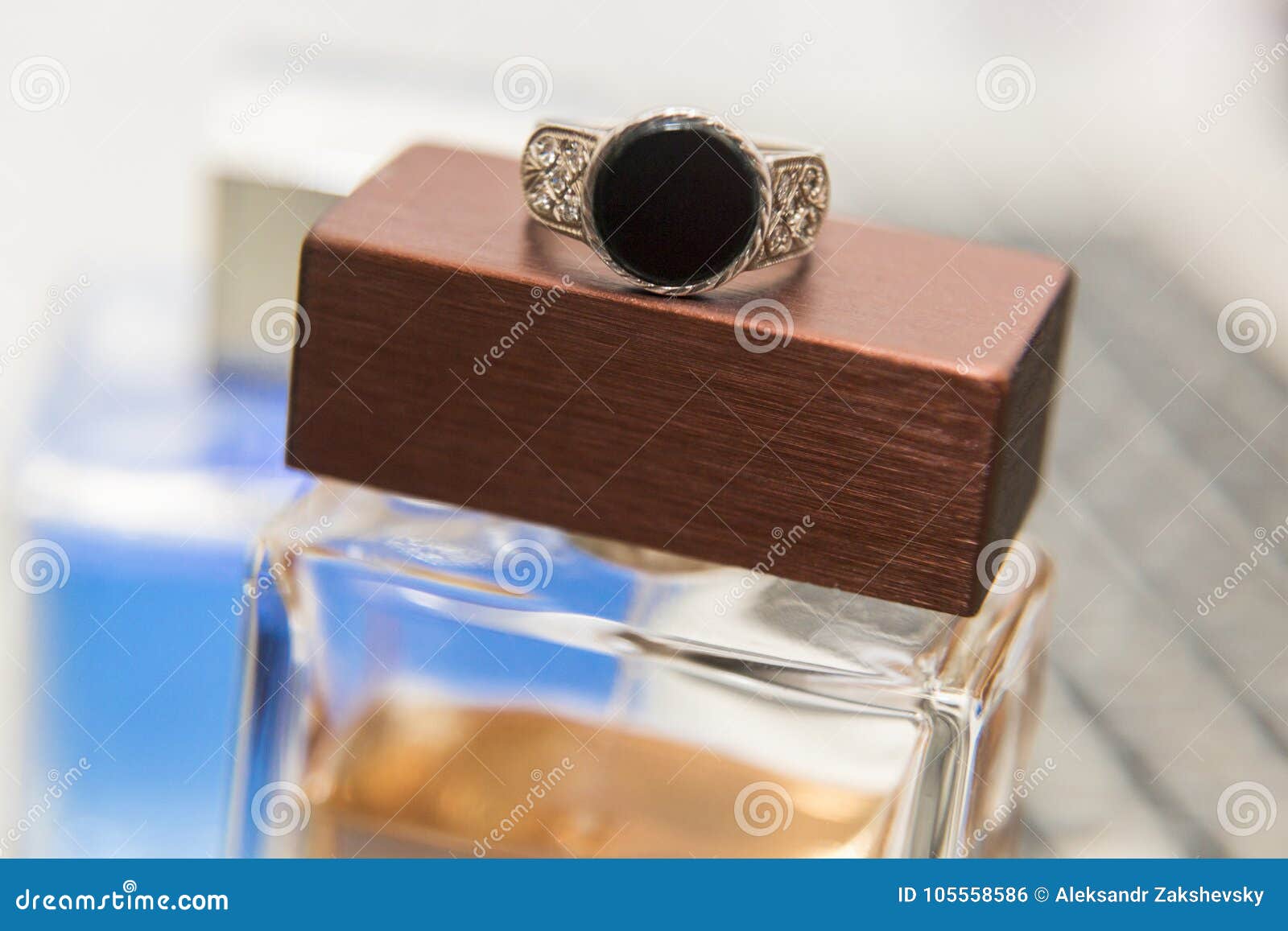 Silver Ring, Perfume and Computer Stock Photo - Image of blue, macro ...