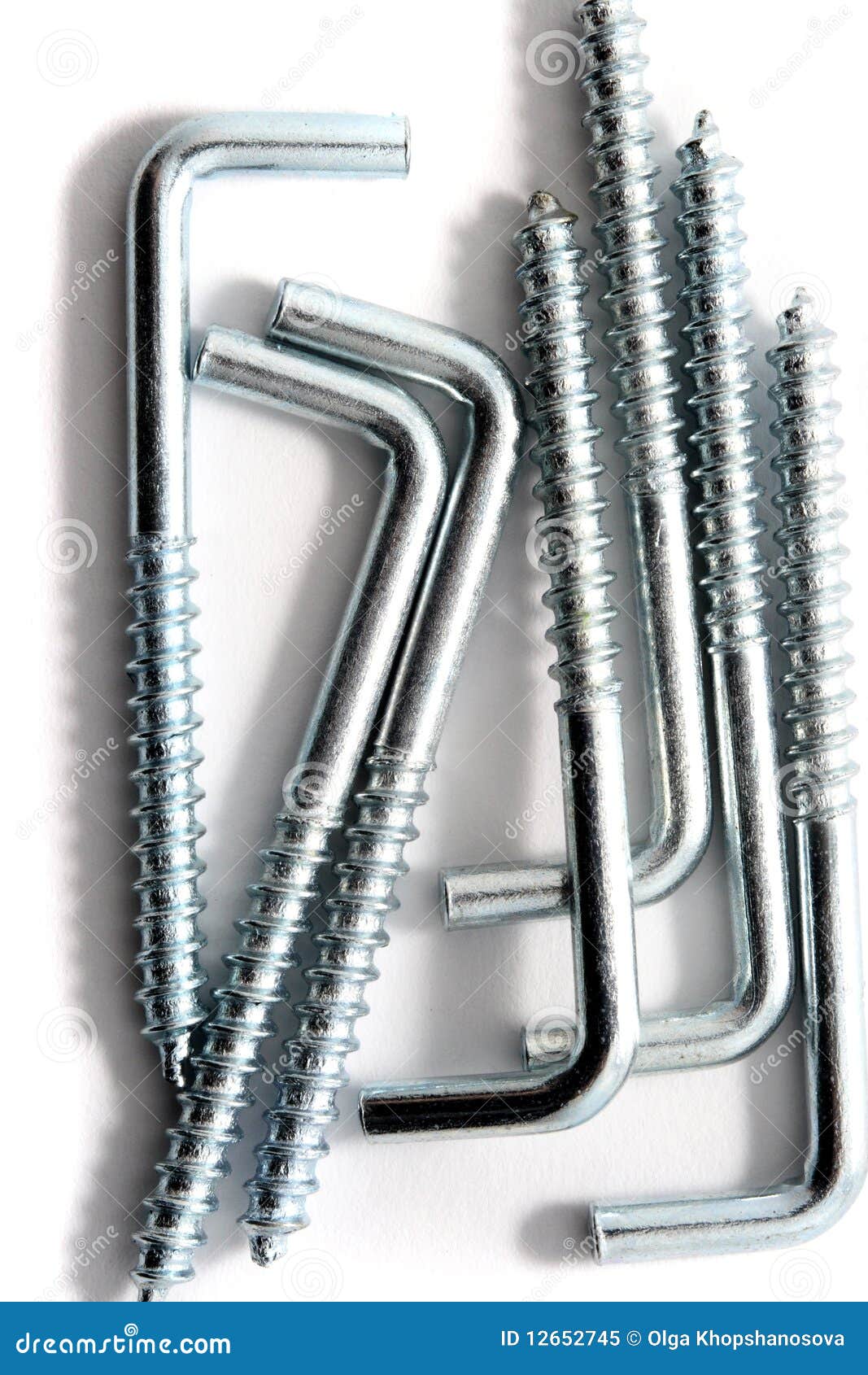 Silver screws in a raw stock image. Image of equipment - 12652745