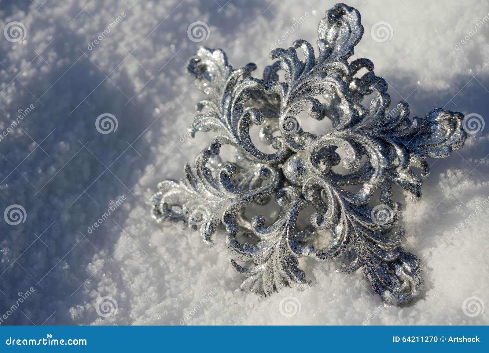 Silver Snowflake on Snow stock photo. Image of ornate - 64211270