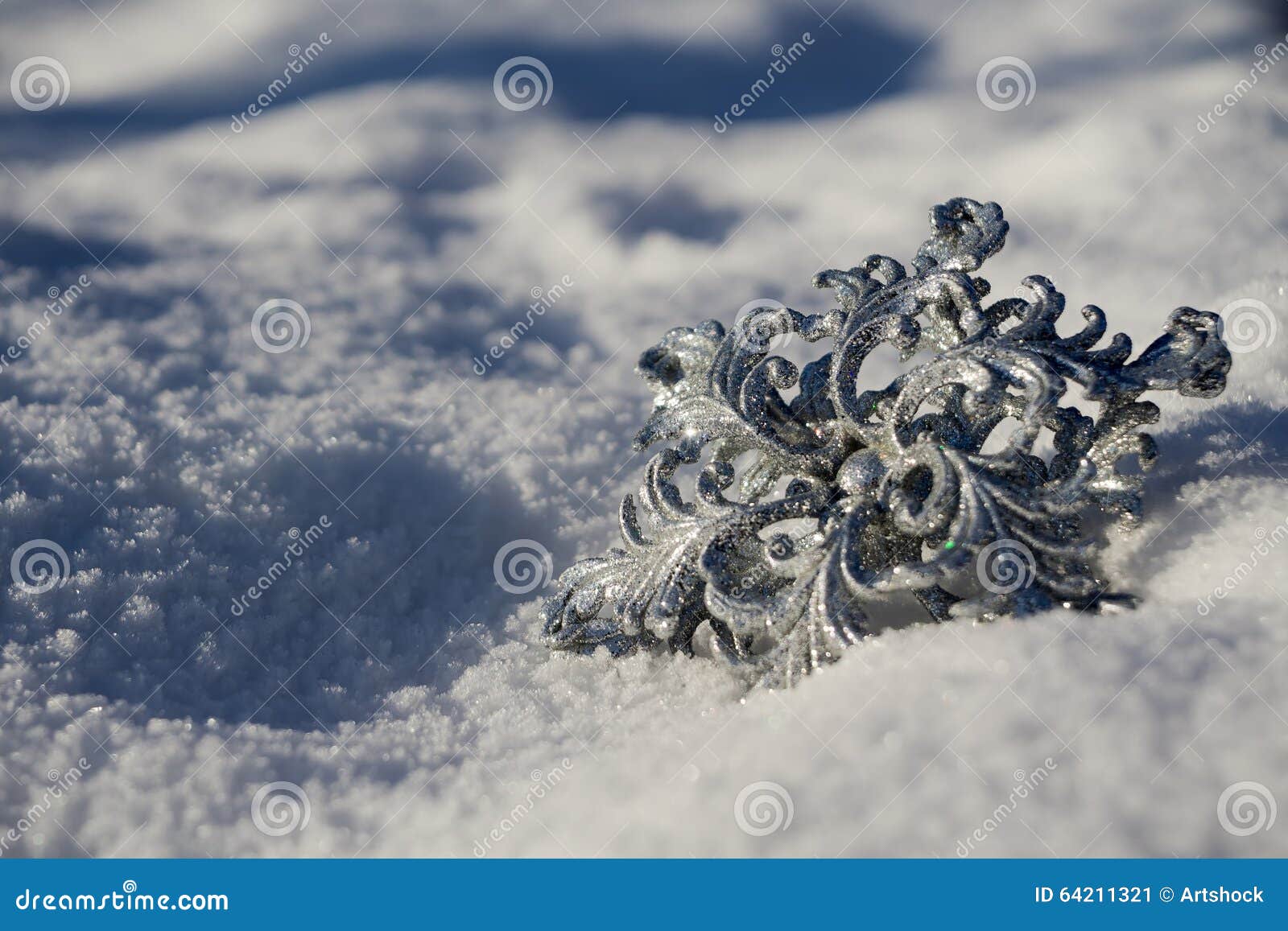 Silver Snowflake on Snow stock image. Image of glittering - 64211321