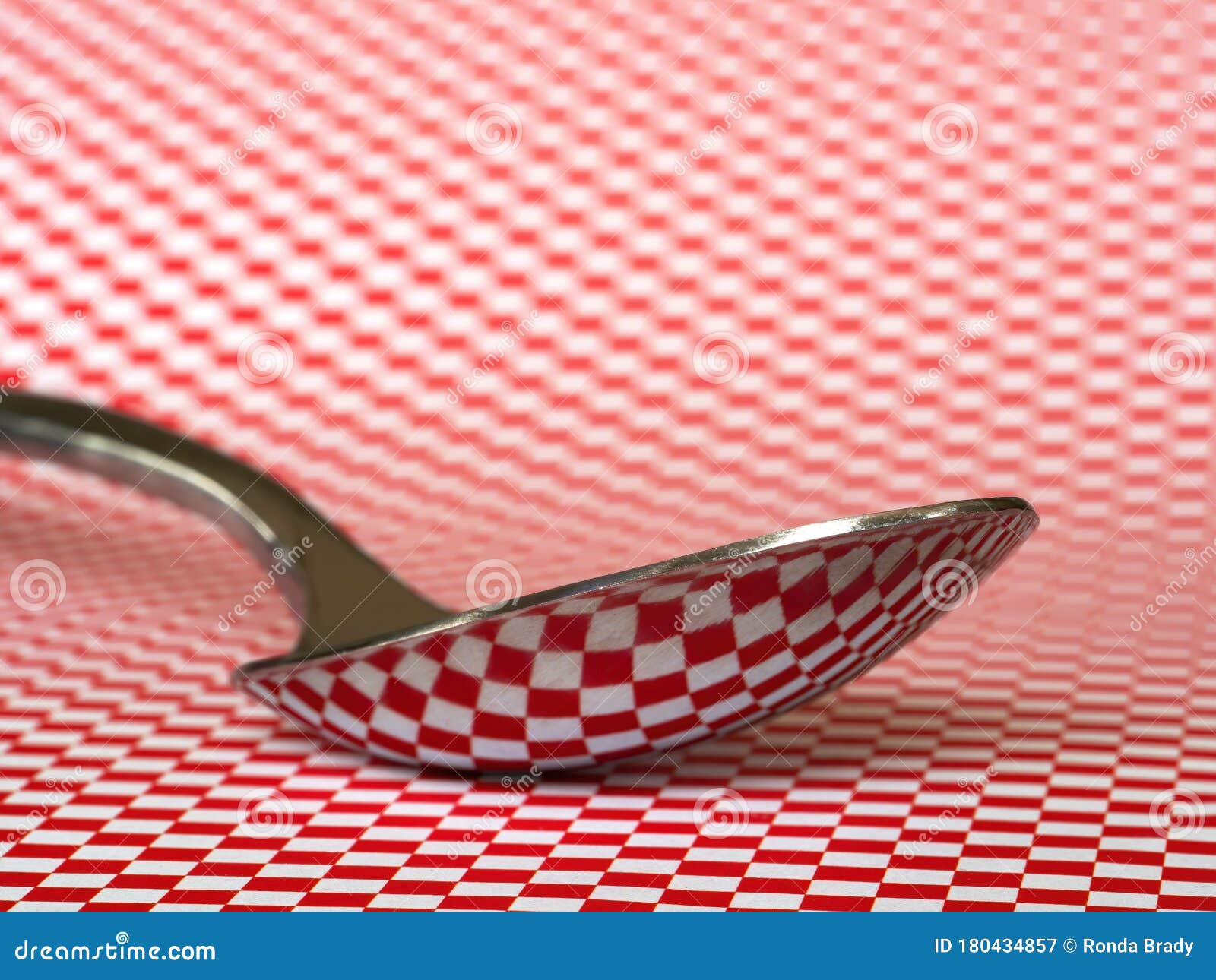 Spoon with Red and White Checkers Reflected Stock Image - Image of ...