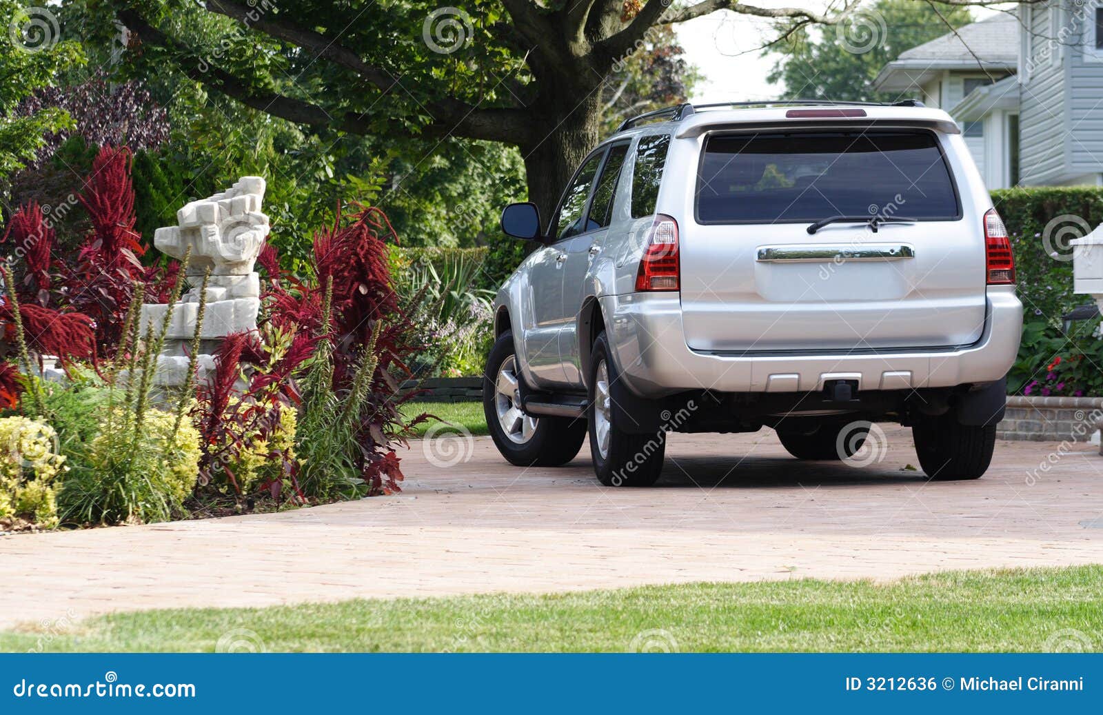 Silver SUV in Driveway stock photo. Image of vehicle, truck - 3212636
