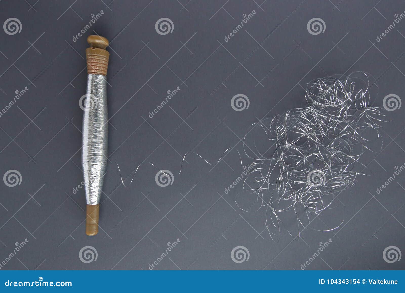 Silver Thread Pile Like Cloud and Spool of Silver Thread. Stock Photo ...