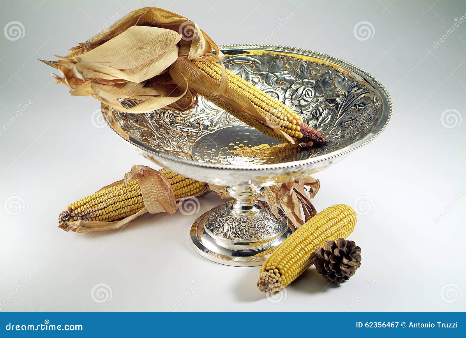Silver vase with corn cobs stock image. Image of design - 62356467