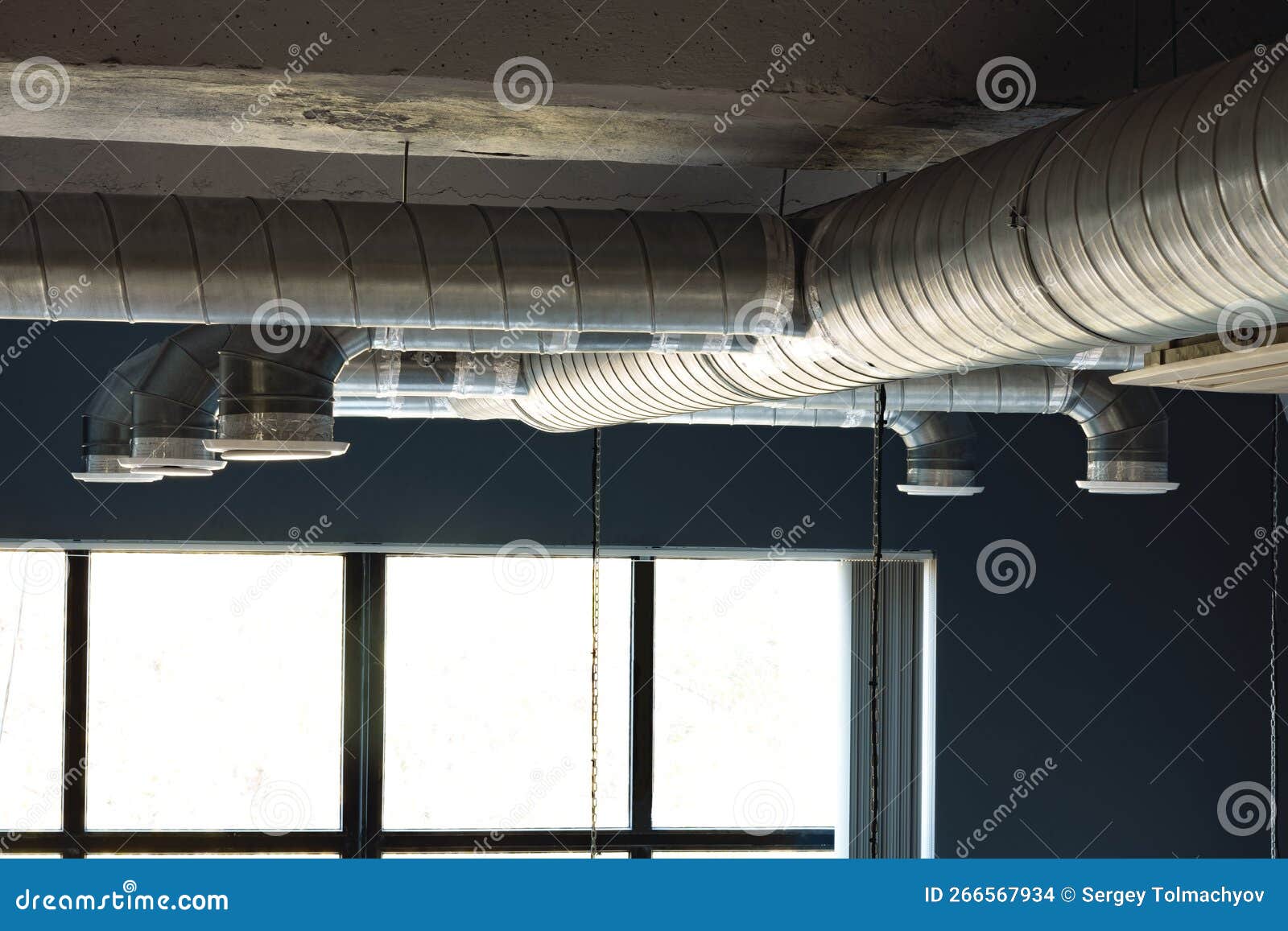 Silver Ventilation Pipes Hanging from the Ceiling Inside the Building ...