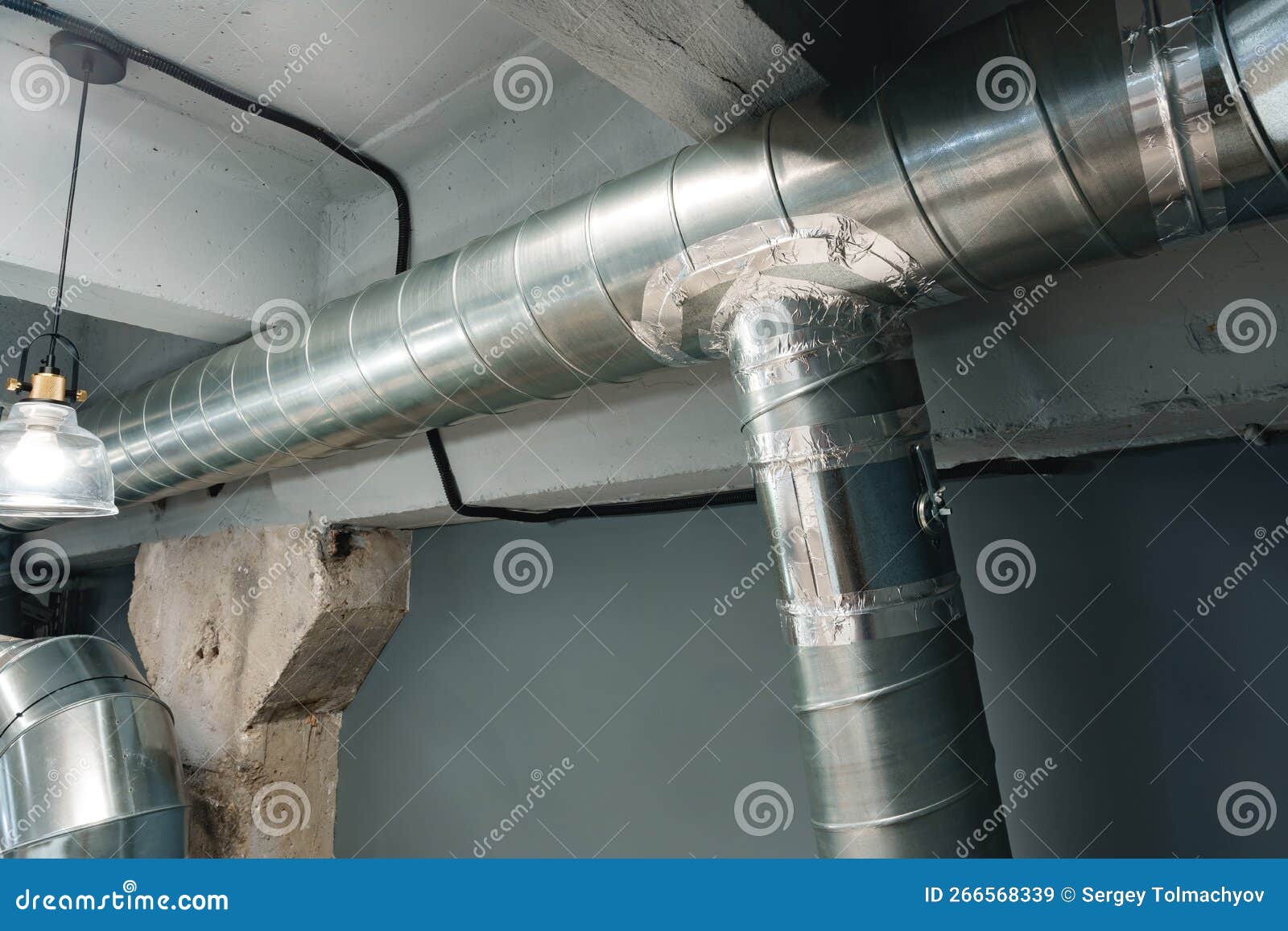 Silver Ventilation Pipes Hanging from the Ceiling Inside the Building ...