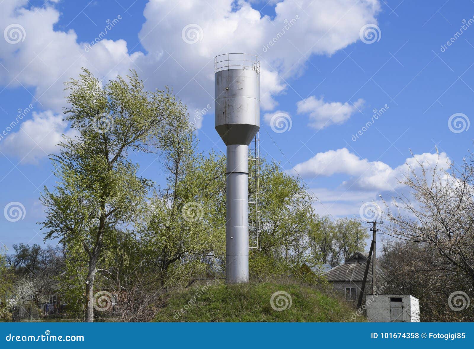 Silver Water Tower among Green Grass and Trees Stock Photo - Image of ...