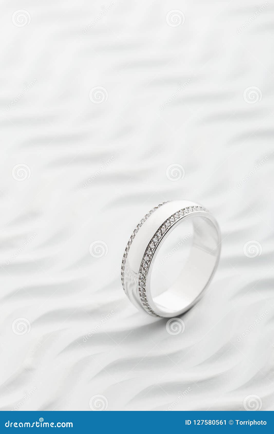 Silver Wedding Ring with Diamonds on White Textured Background Stock ...