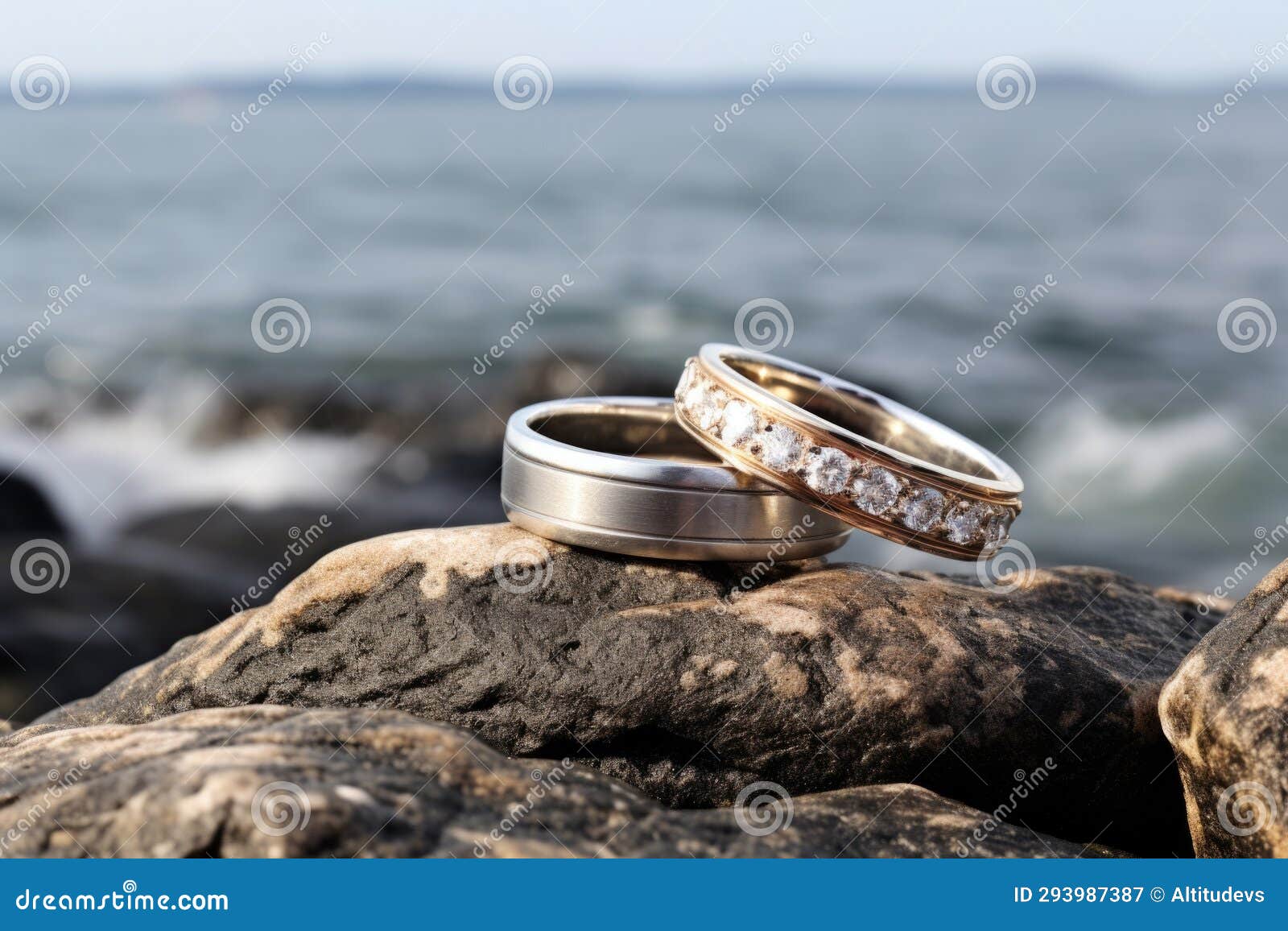 Silver Wedding Rings on a Rough Granite Stone, with Sea Waves in the ...