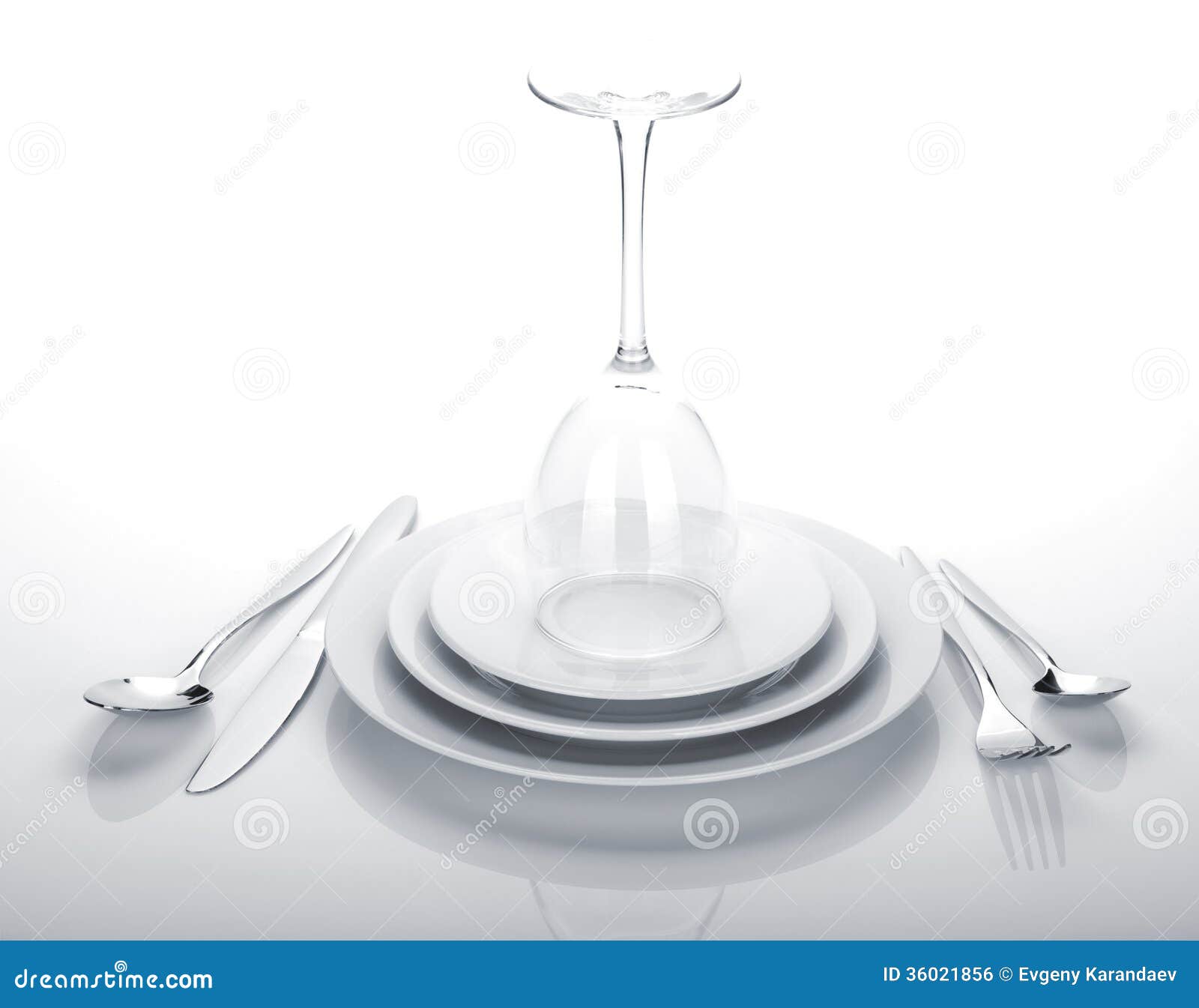 Silverware or Flatware Set and Wine Glass Over Plates Stock Photo ...