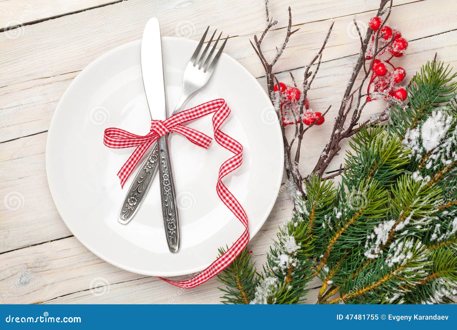 Silverware on Plate and Christmas Tree Decor Stock Image - Image of ...