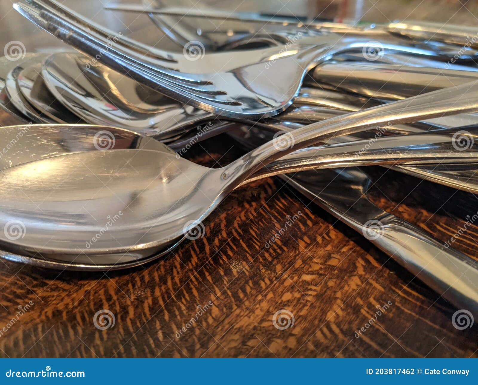 Silverware on wood table stock photo. Image of table - 203817462