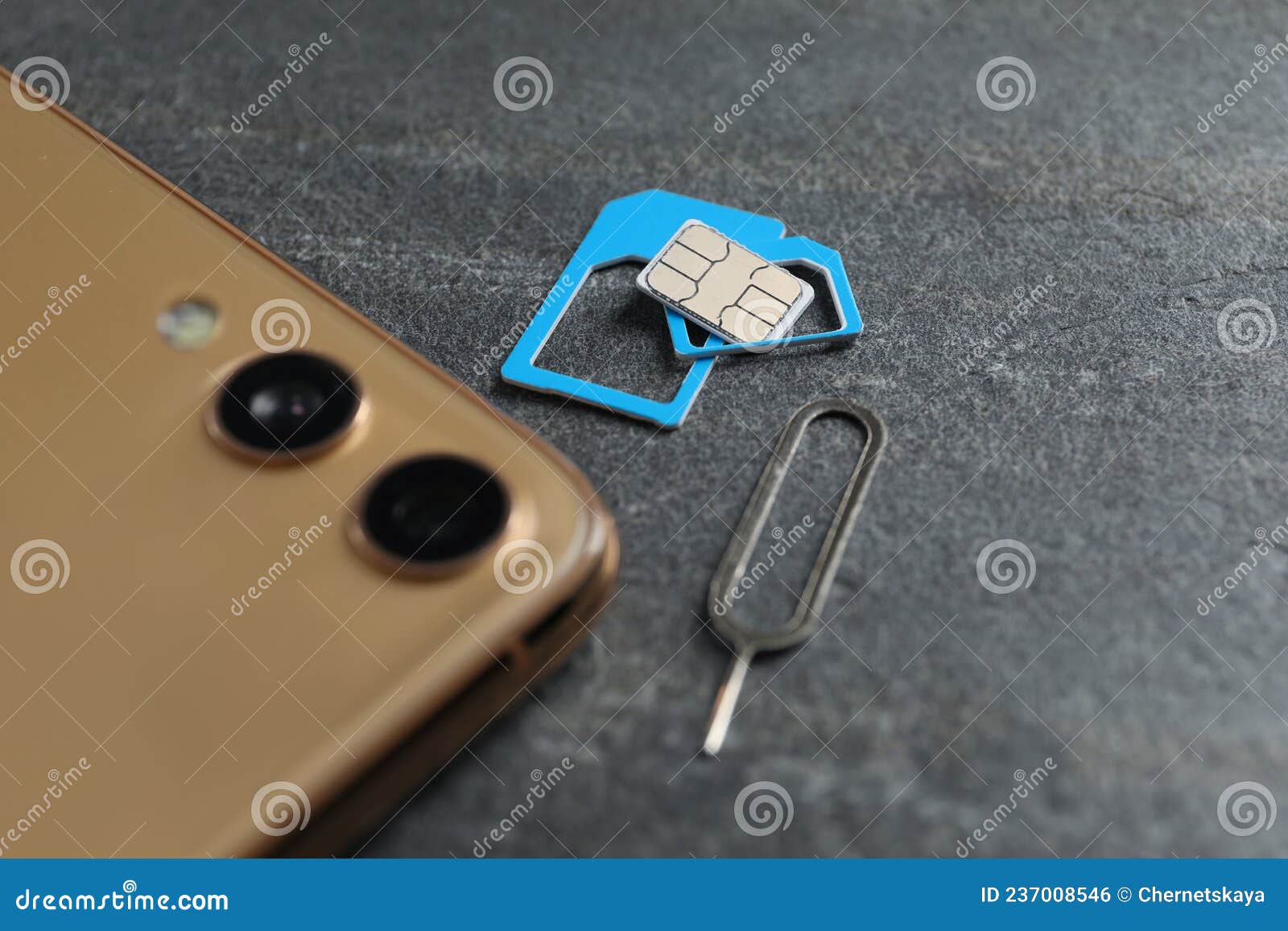 SIM Card, Mobile Phone and Ejector Tool on Grey Table, Closeup Stock ...