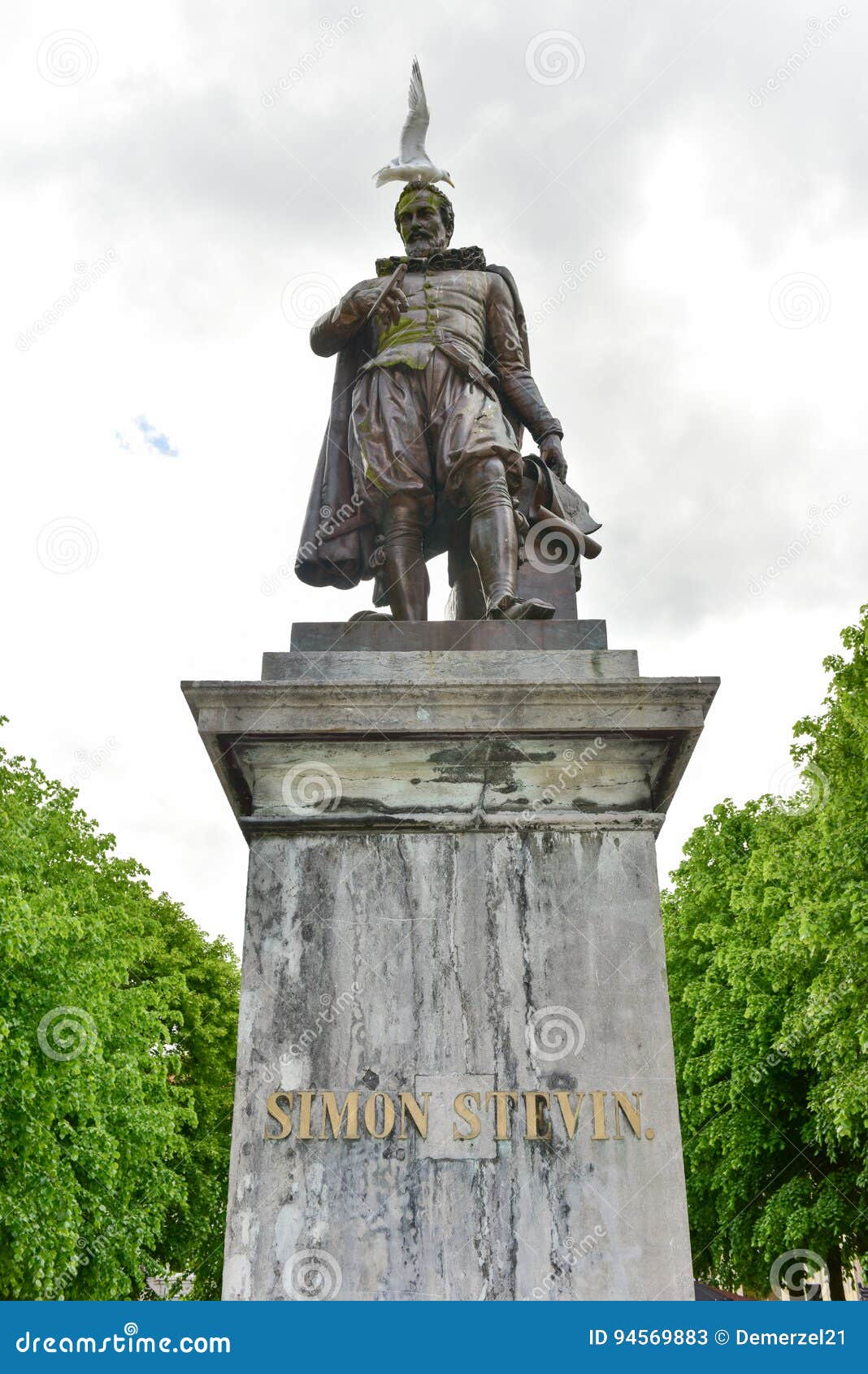 Simon Stevin Bronze Statue In Bruges With Park And Church As Background ...