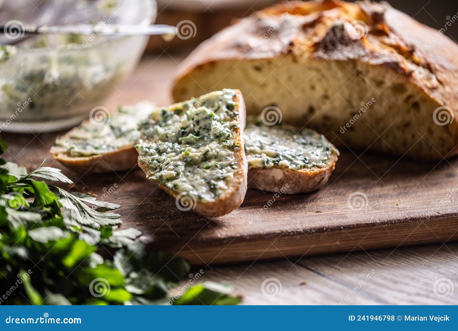 Simple Appetizer in a Form of Bread Slices with Herb Butter on Top ...