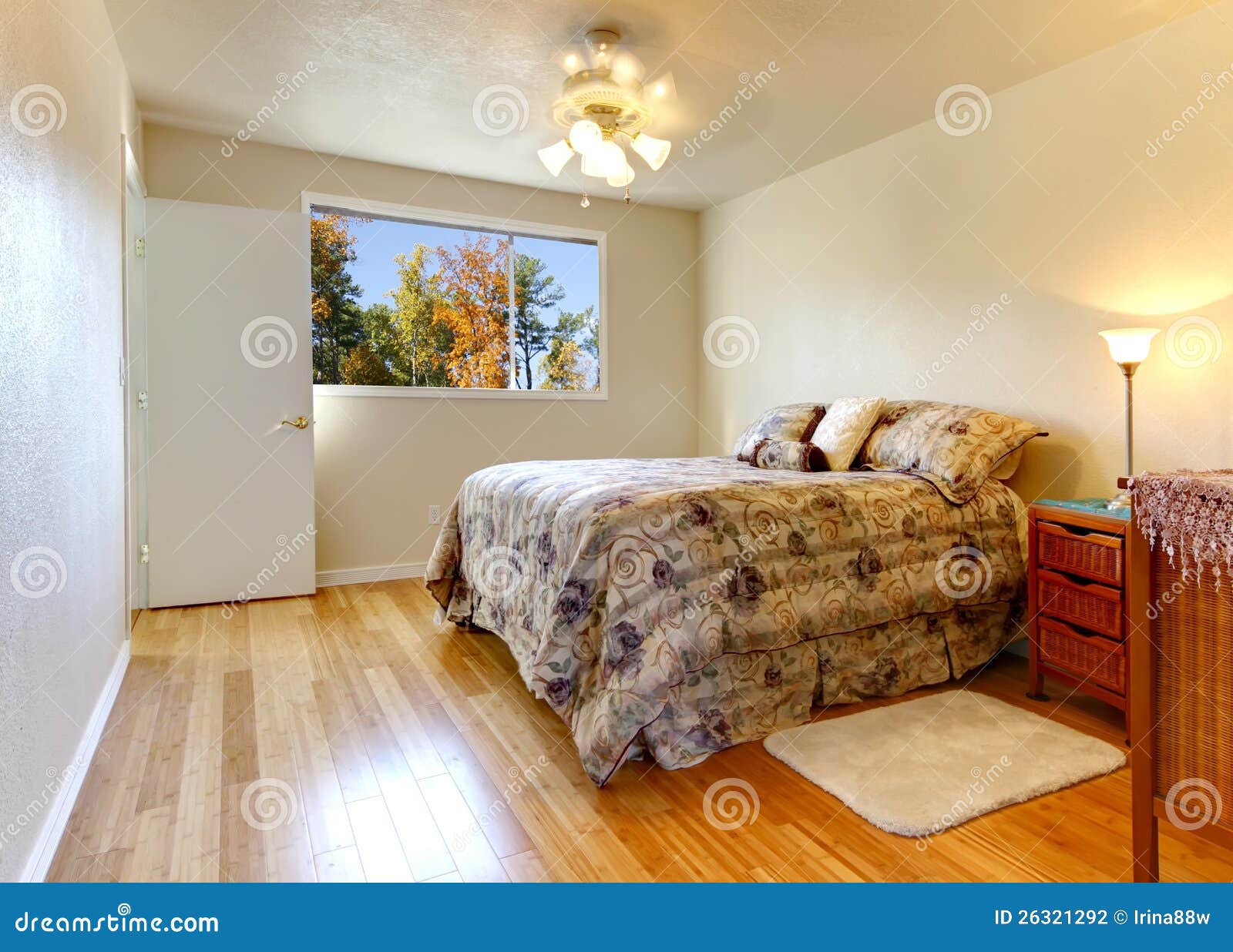 Simple Bedroom with Hardwood Floor and Fall Window View. Stock Photo ...