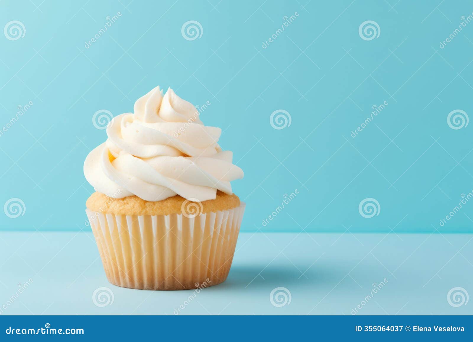 Simple Birthday Cupcake on a Solid Light Blue Background with Empty ...