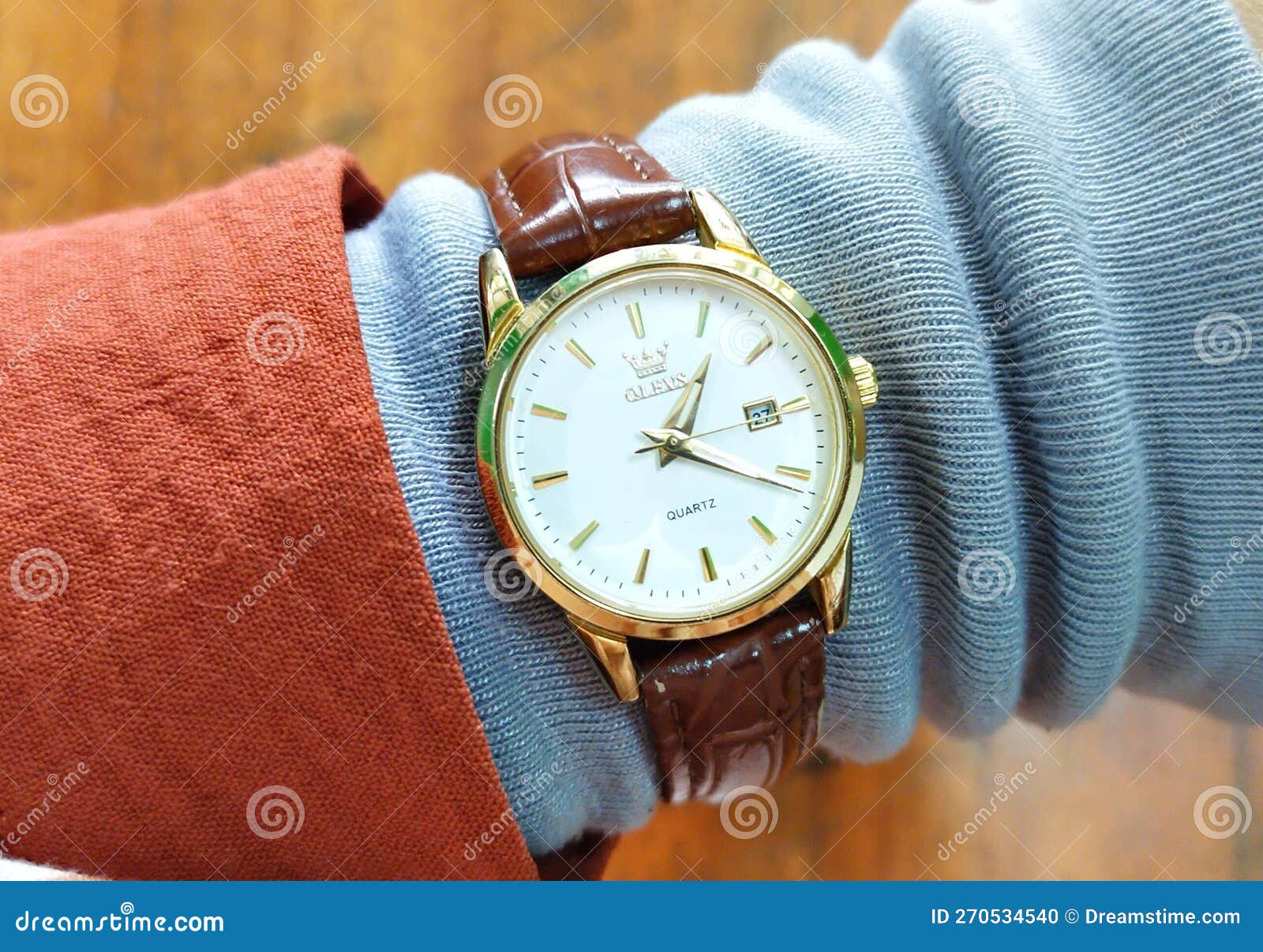 Simple Brown Watch on the Hand Editorial Image - Image of blue, strap ...