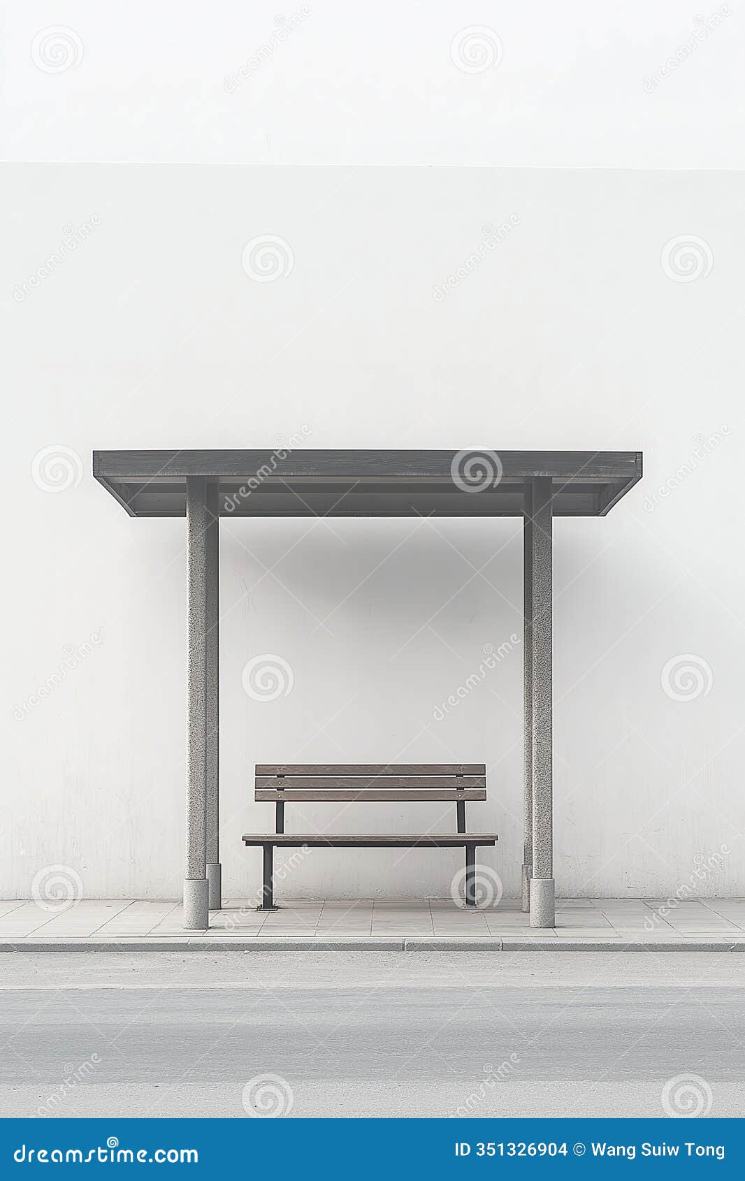 A Minimalist Bus Stop with a Gray Bench Under a Sleek Canopy in an ...