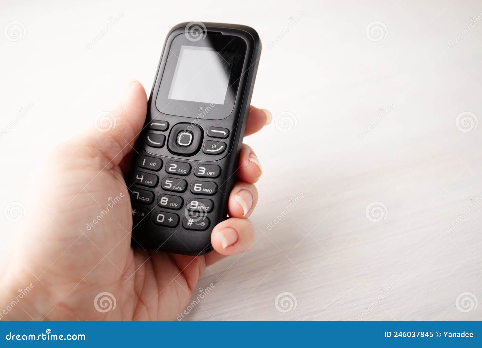 Simple Cellphone in Hand, with Buttons, the Old Type Stock Image ...