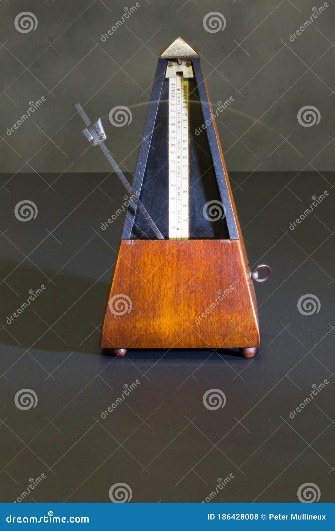 Metronome showing movement stock photo. Image of used - 186428008