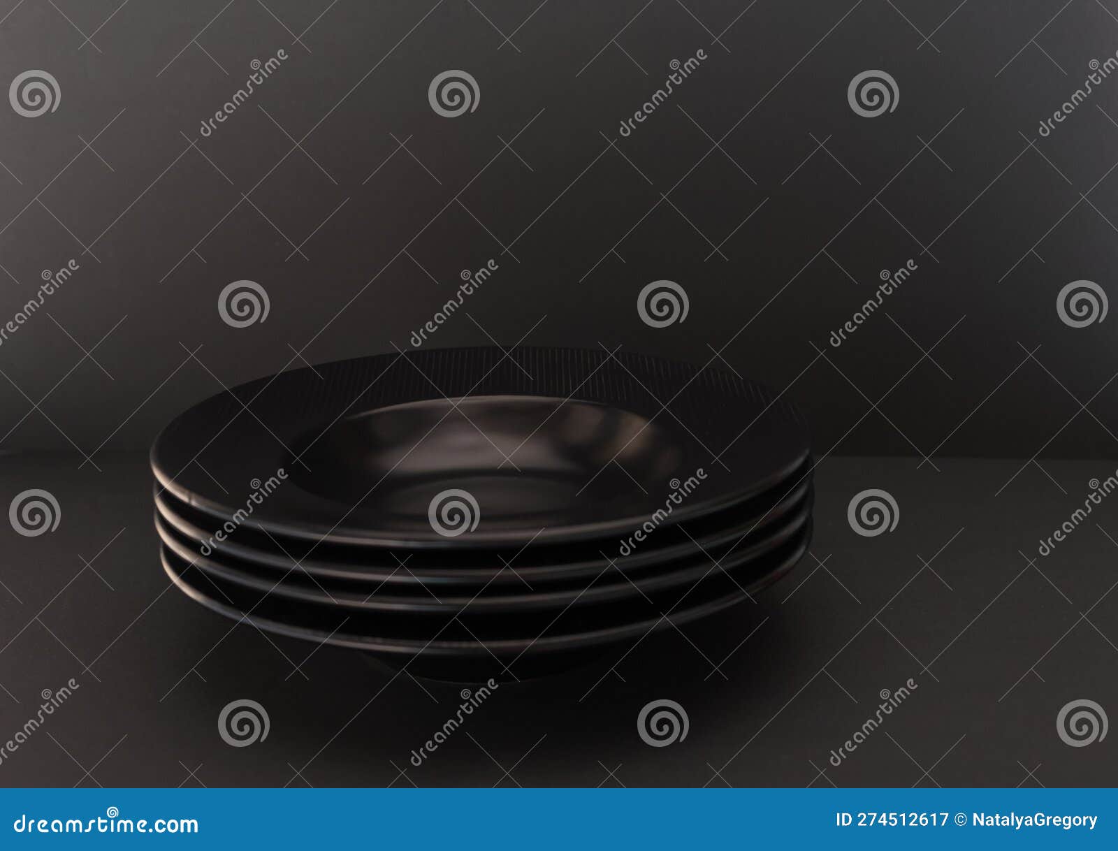 A Simple Composition of a Stack of Black Plates on a Black Background ...